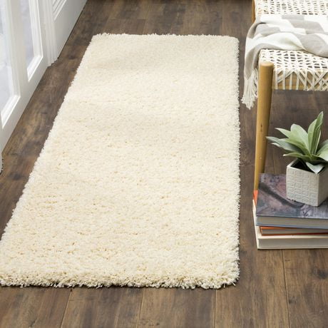 Click here for Safavieh California Solid Plush Shag Area Rug Ivor... prices